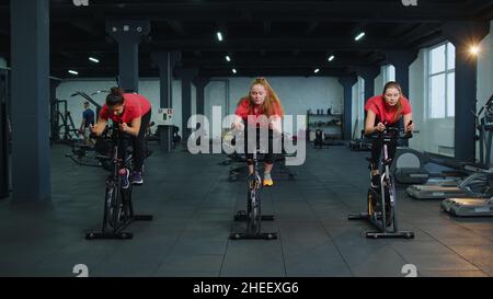 Group of people performs aerobic training workout cardio routine on ...