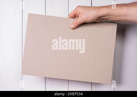 a cardboard sign held in hand Stock Photo - Alamy