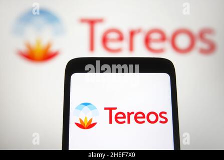 In this photo illustration, a Tereos SA logo is seen on a smartphone and a computer screen ...