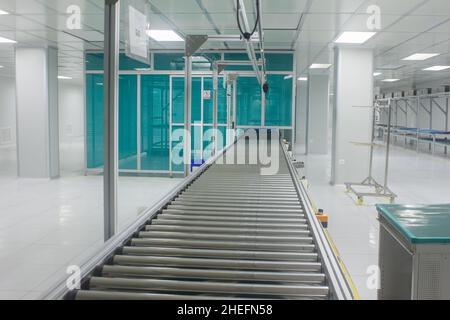 Special roller conveyor in clean room. picture blurred Stock Photo - Alamy