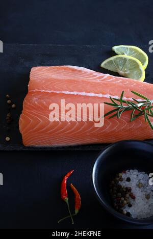Fresh Salmon Steak with herbs and spices Stock Photo - Alamy