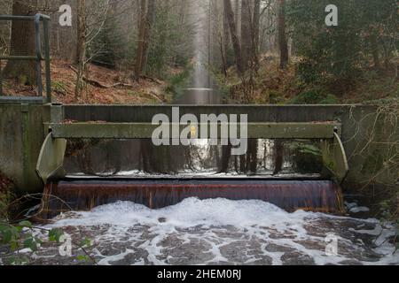 Small overflow dam in a river Stock Photo - Alamy