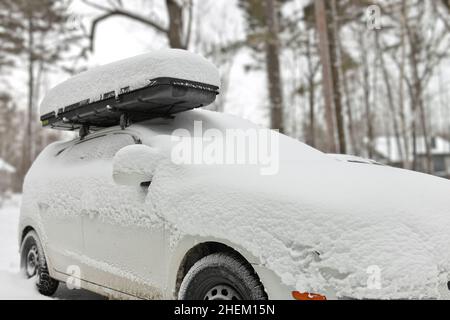 Passenger car in deep snow on small street Stock Photo - Alamy