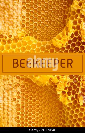 Word BEEKEEPER on honey combs Stock Photo - Alamy