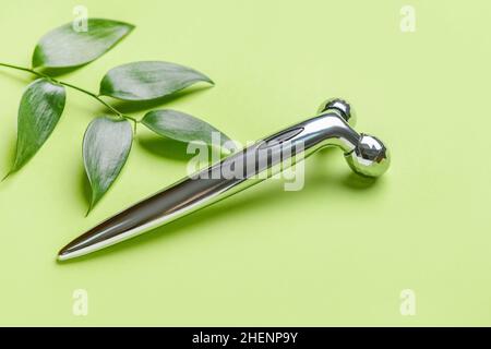 Face massage roller on color background Stock Photo - Alamy