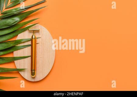 Face massage roller on color background Stock Photo - Alamy