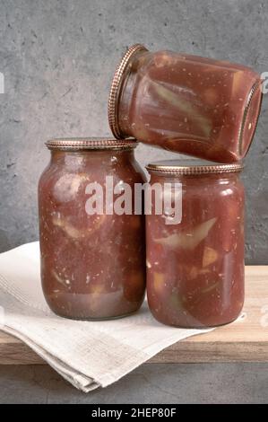 Lecho in glass jars on a wooden table Stock Photo - Alamy