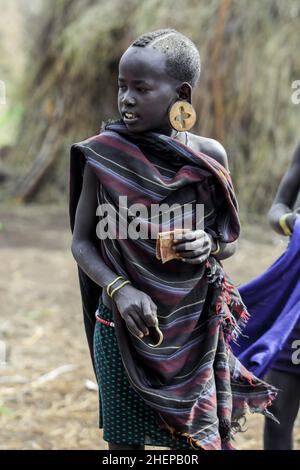 Mursi boys in the Lower Omo Valley of Ethiopia Stock Photo - Alamy