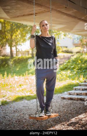 Spring romantic woman swinging on swing. Banner for website header ...