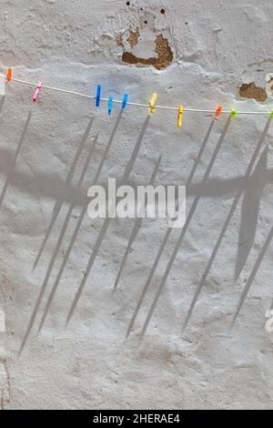 detail of clothesline hanging at old whitewashed wall Stock Photo - Alamy