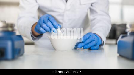 Chemist performs an experiment with liquid nitrogen in laboratory ...