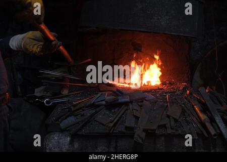 Fire in fireplace with wrought iron grate. Timberline Lodge, Oregon ...