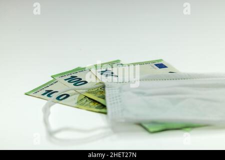 100 euro money banknotes with a face mask Stock Photo - Alamy