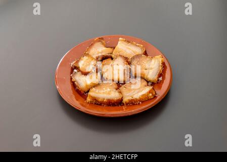 A torrezno is a strip of bacon, always with the skin on, fried or ...