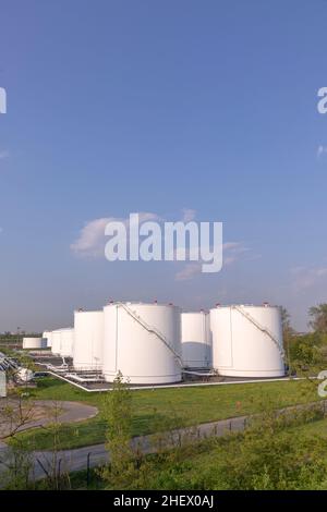 white oil tanks under blue sky Stock Photo - Alamy