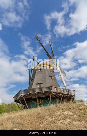 old wooden windmill under blue sky Stock Photo - Alamy