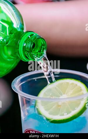 Iced lemonade with limes on wooden plate Stock Photo - Alamy