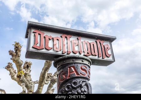 sign Drosselgasse in Ruedesheim, Germany. This narrow street is the ...