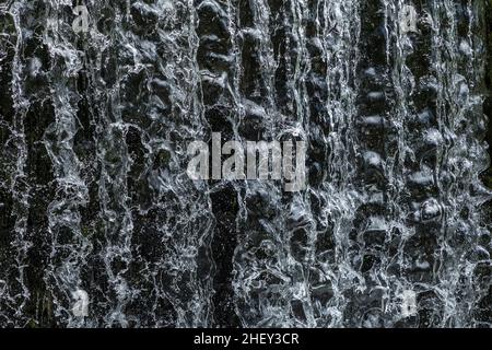 pattern of flowing water at a waterfall gives a harmonic background ...