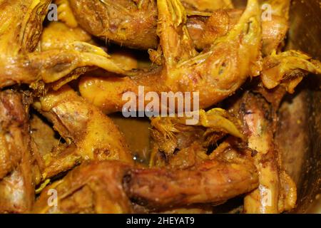 Chicken head that has been given spices ready to be fried Stock Photo ...