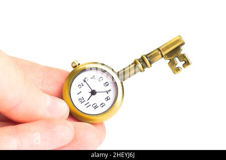 Retro style bronze toned key shaped pocket watch isolated on white ...