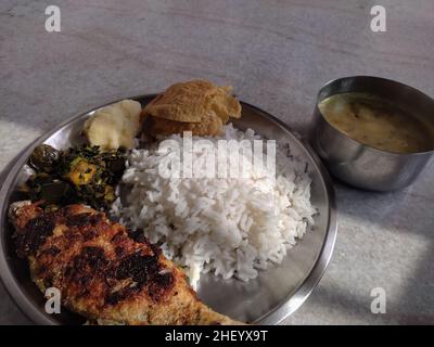 Homemade fish thali meal served at bannana leaf in Kerala state, India ...