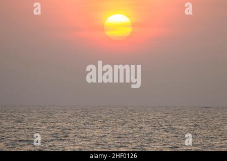 spectacular sunset over the ocean at Mumbai, India Stock Photo - Alamy
