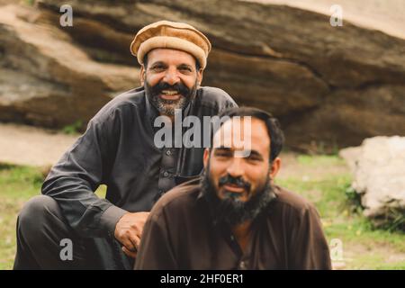 Gilgit, Pakistan - June 09, 2018: Group of an Pakistani Men smiling and ...