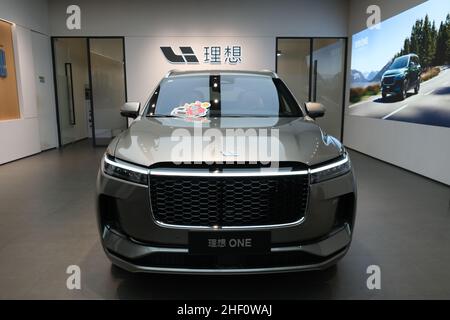 Li Auto(Li Xiang) electric car store and brand logo. A Chinese EV ...