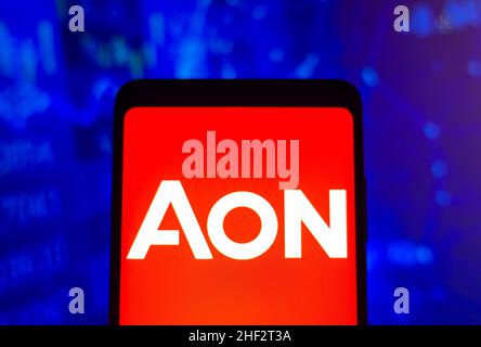 In this photo illustration, the logo of Aon is seen displayed on the ...