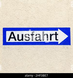 blue sign exit in german painted at a wall Stock Photo - Alamy