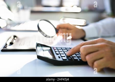 Business Auditor Using Magnifying Glass For Paperwork Fraud ...