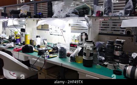 Camera and lens repair workstation with equipment and tools Stock Photo ...