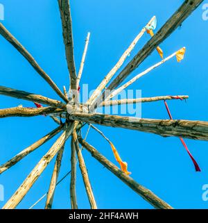 Tipee stakes and ribbons shown against a blue sky Stock Photo - Alamy