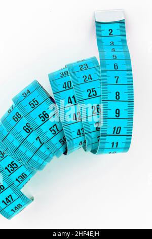 Sewing blue meter on white background Stock Photo - Alamy