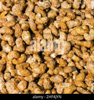 fresh caramelized almond isolated at an outdoor market shop Stock Photo ...