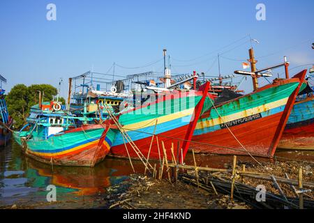 A wooden fishing boat is parked at the mouth of the Juwana River, Pati ...
