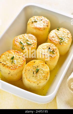 Cooked fondant potatoes over light background. Top view, flat lay Stock ...