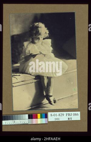 Seated girl reading a book] / EW Stock Photo - Alamy