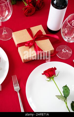 Table setting for Valentine's Day with rose on white background Stock Photo - Alamy