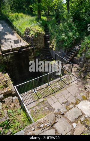 The ruins of the old spinning-mill in an autumnal landscape at ...