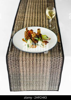 Chinese cabbage rolls on white dish with creamy cheese Stock Photo - Alamy