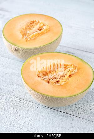 Cross section of Cantaloupe melon flat lay Stock Photo - Alamy