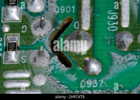 Damaged printed circuit board (PCB) with leaked electrolytic capacitor ...