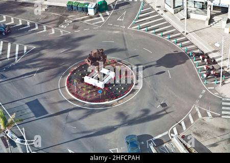 roundabout with sculpture of old cars Stock Photo - Alamy