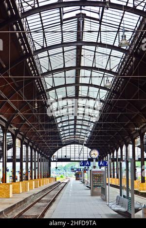 classicistic iron train station from inside with train Stock Photo - Alamy