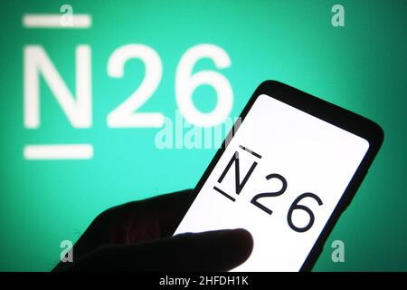The logo of N26 is seen on a screen of a smartphone next to an ...