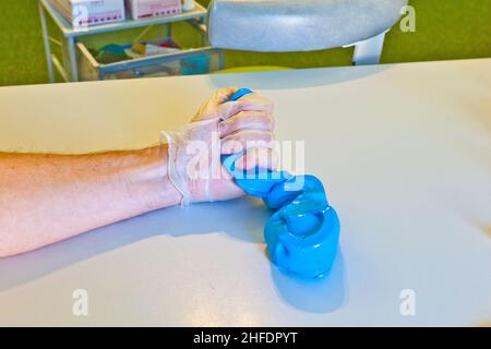 hand physiotherapy to recover a broken finger Stock Photo - Alamy
