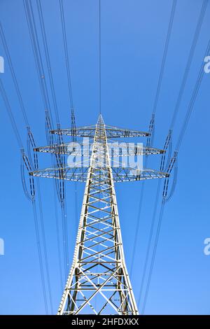 electrical pylon under blue sky, power line cable Stock Photo - Alamy