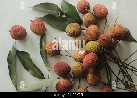 litchi, lichee, lychee, or lichi, Litchi chinensis on old rustic wood ...